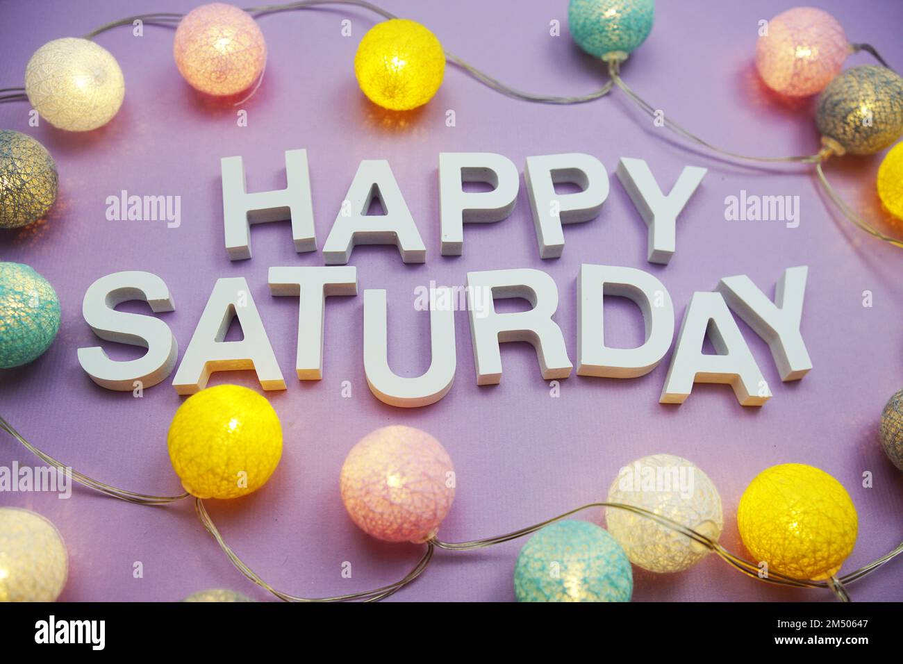 Happy Saturday alphabet letters with LED cotton balls on purple ...