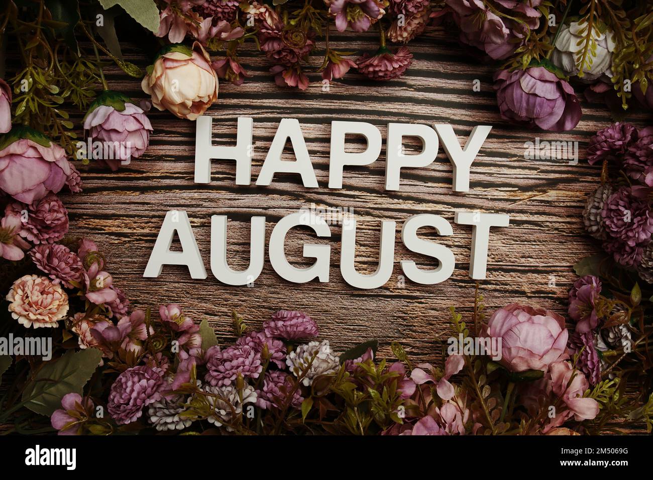 Happy August alphabet letters with flowers frame on wooden background ...