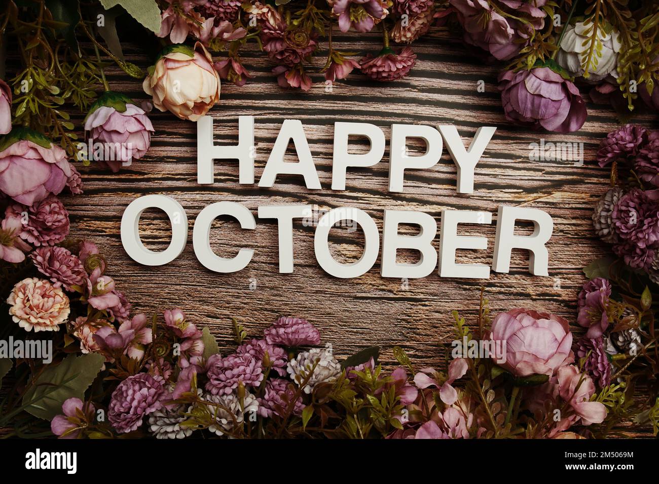 Happy October alphabet letters with flowers frame on wooden background ...