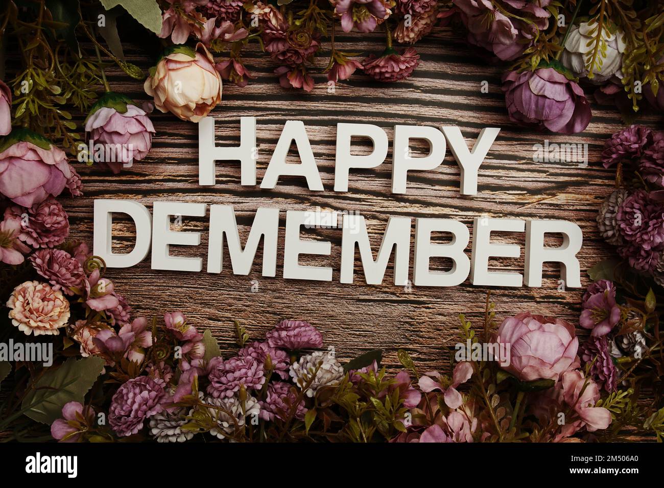 Happy December alphabet letters with flowers frame on wooden background ...