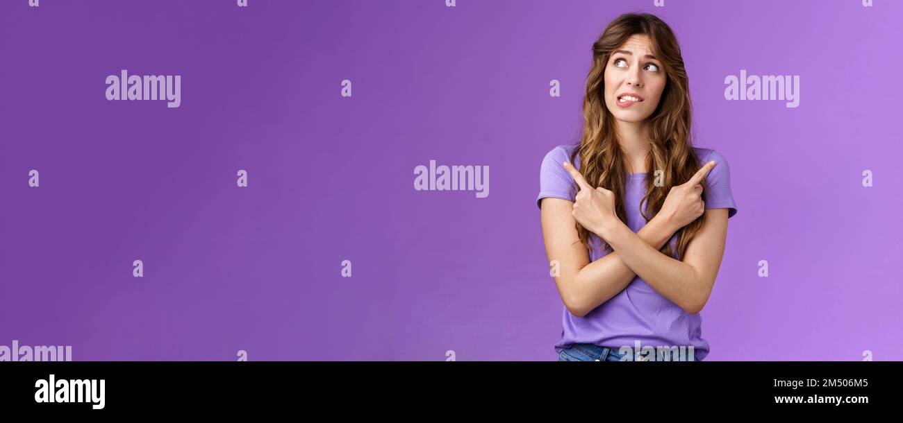 Hesitant unsure worried girl complicated make difficuly choice frowning ...