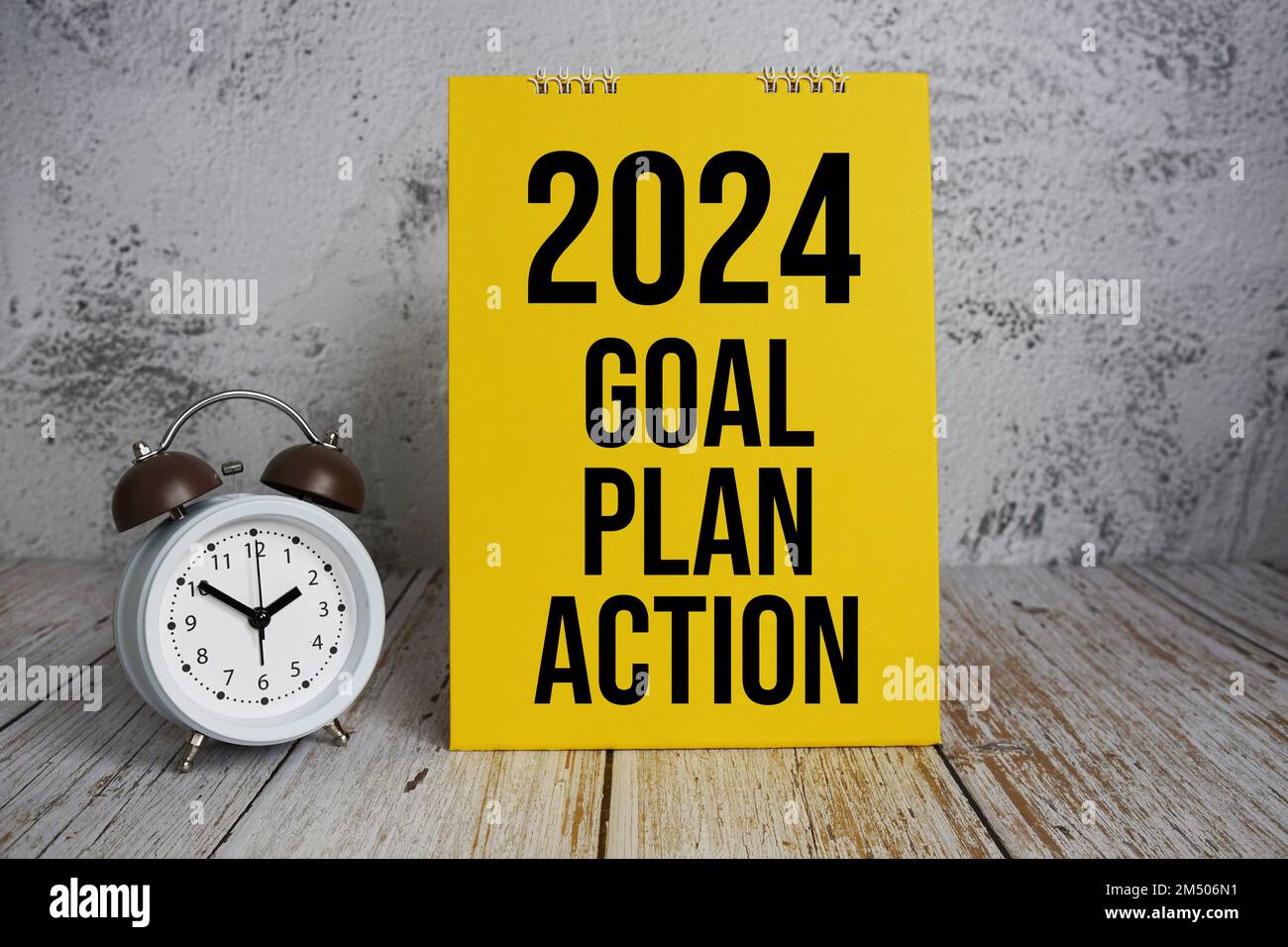 2024 Goal, Plan, Action text message and alram clock on wooden ...