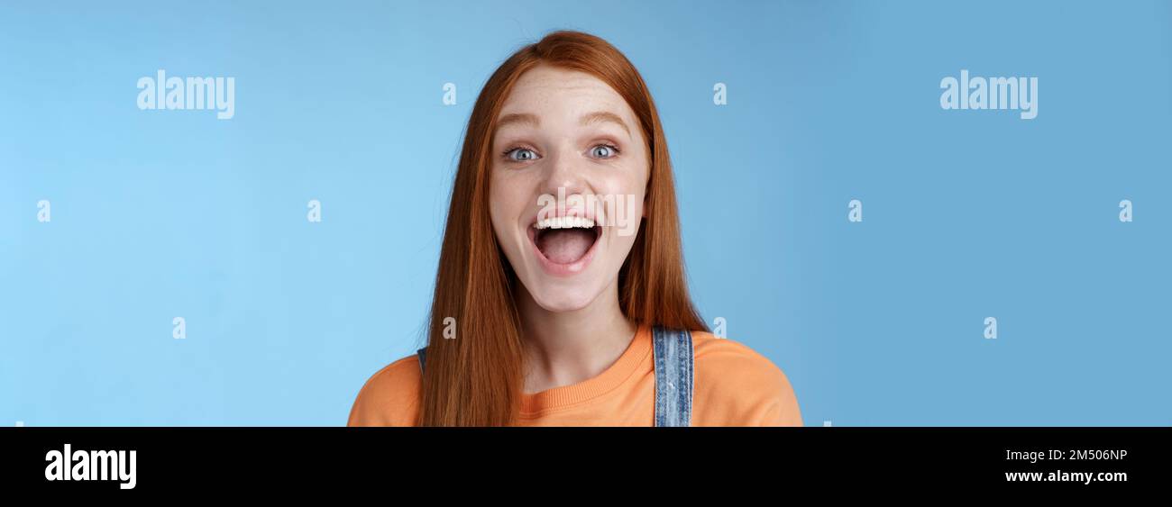 Amused charismatic lively outgoing ginger girl thrilled having fun ...