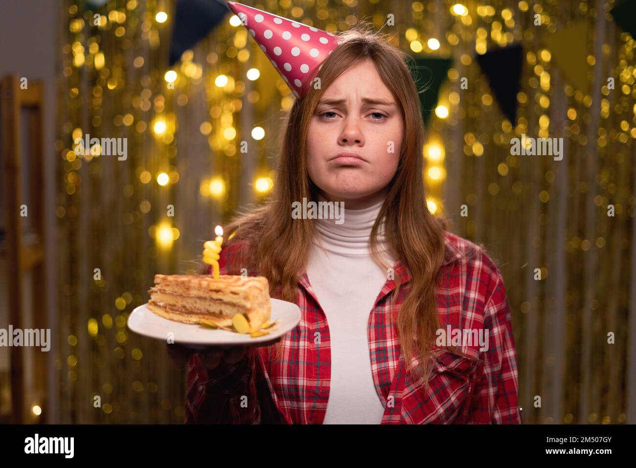 Holidays and celebration at home. Sad cute girl celebrating her ...