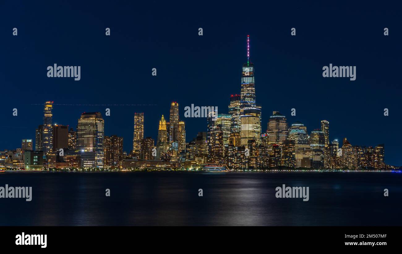 An amazing view of the New York City Manhattan skyline illuminated with ...