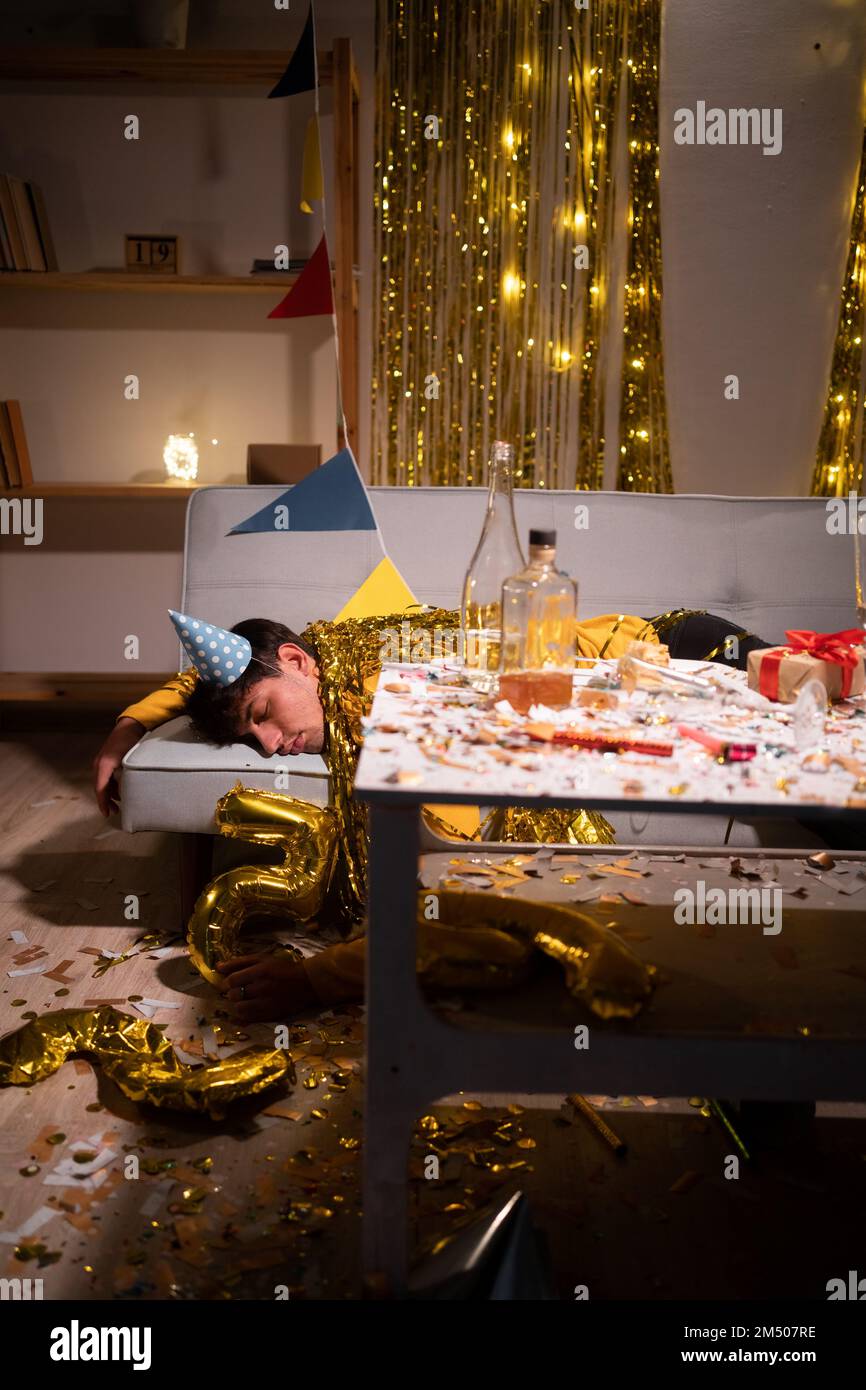Tired drunk man after party at home sleep on couch. Copy space Stock ...