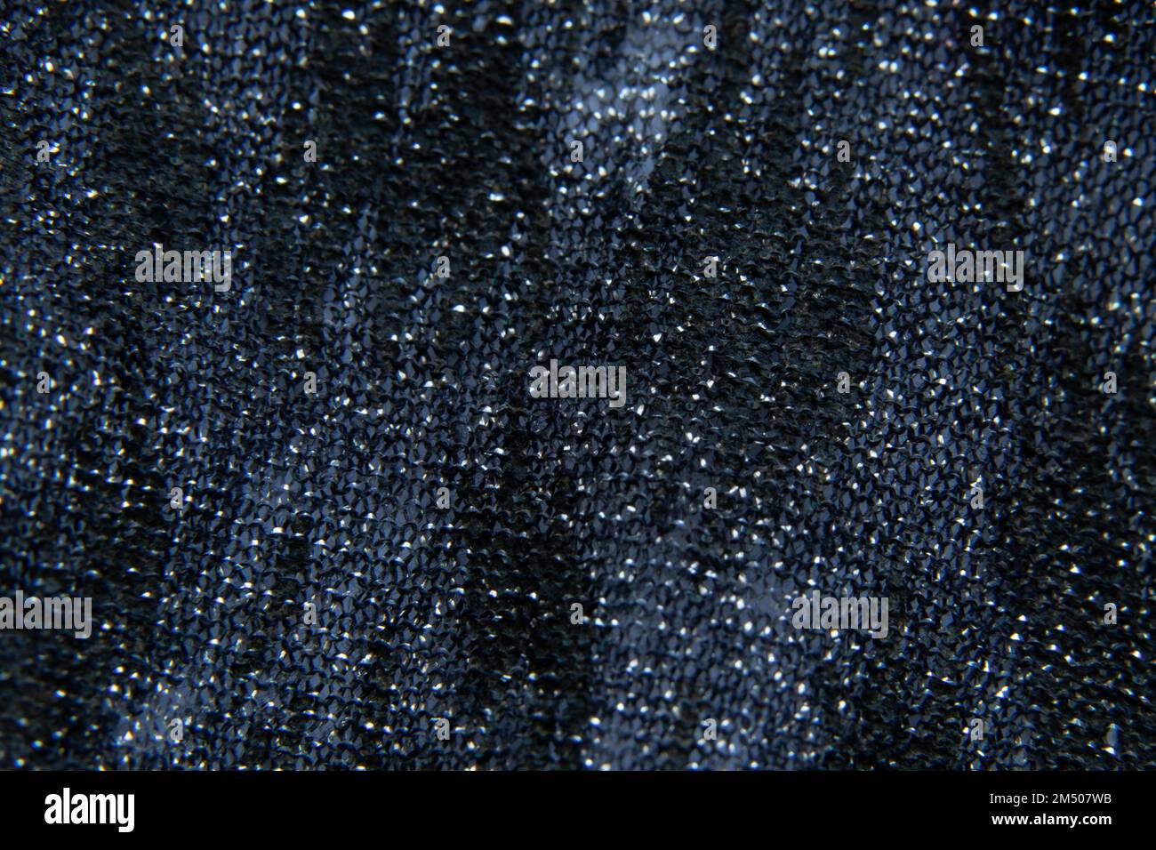 black shiny plain fabric close-up Stock Photo - Alamy
