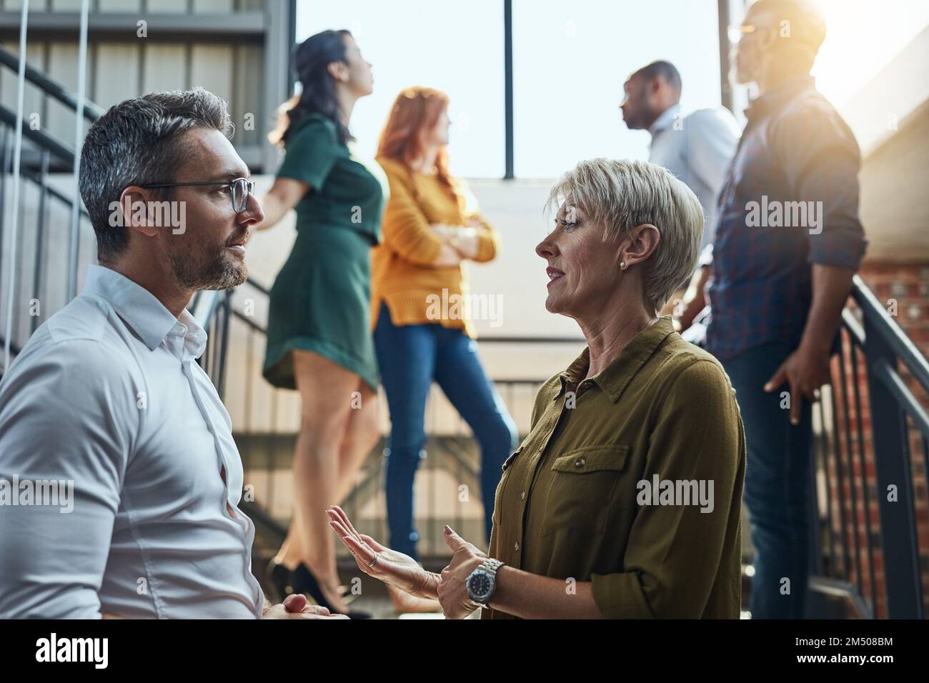 Always talking business everywhere. a group of business colleagues ...