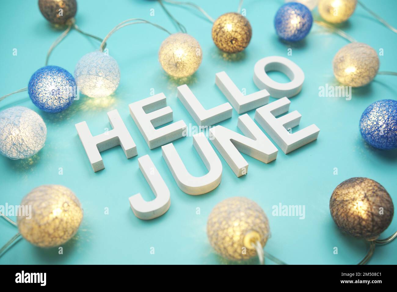 Hello June alphabet letter decorate with LED cotton balls on blue ...