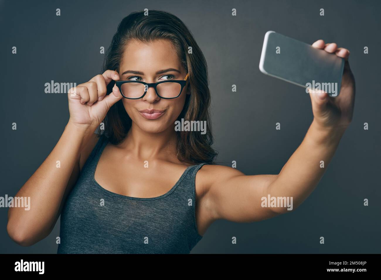 Feast your eyes on these. Studio shot of an attractive young woman ...