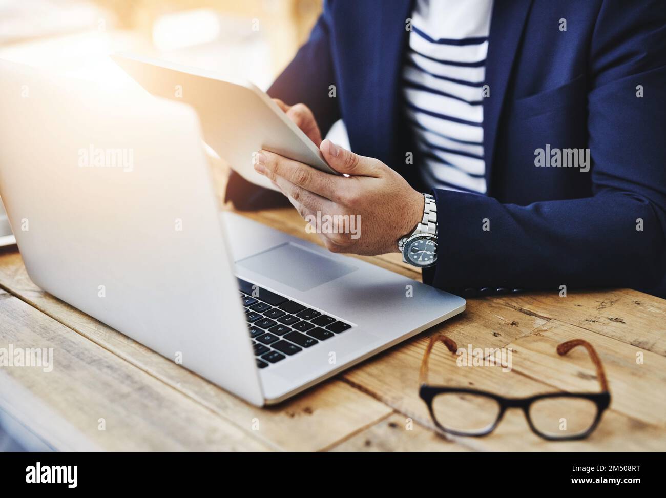Simplifying the work task with smart technology. a businessman using a ...