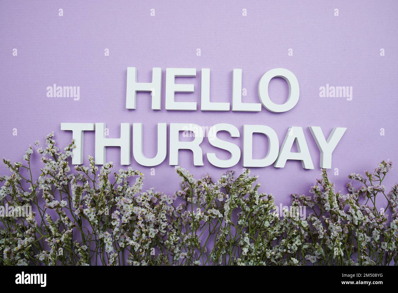 Hello Thursday alphabet letters with flower frame on purple background ...