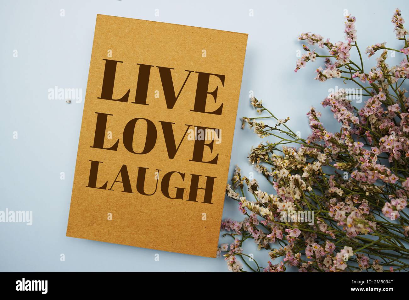 Live Laugh Love text message with flower decoration blue background ...