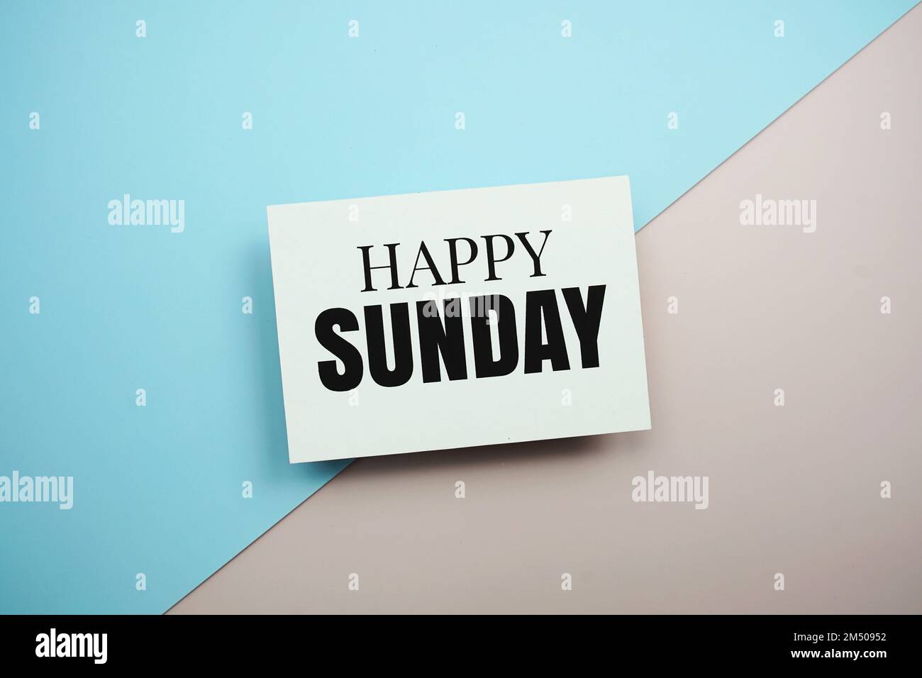 Happy Sunday text message on blue and pink background Stock Photo - Alamy