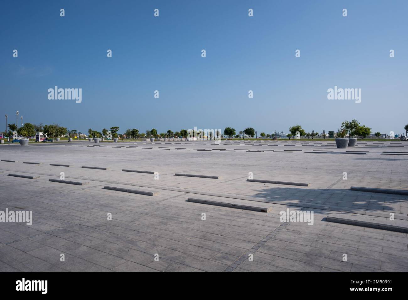 Empty parking lot near flag plaza park in Doha, Qatar Stock Photo - Alamy