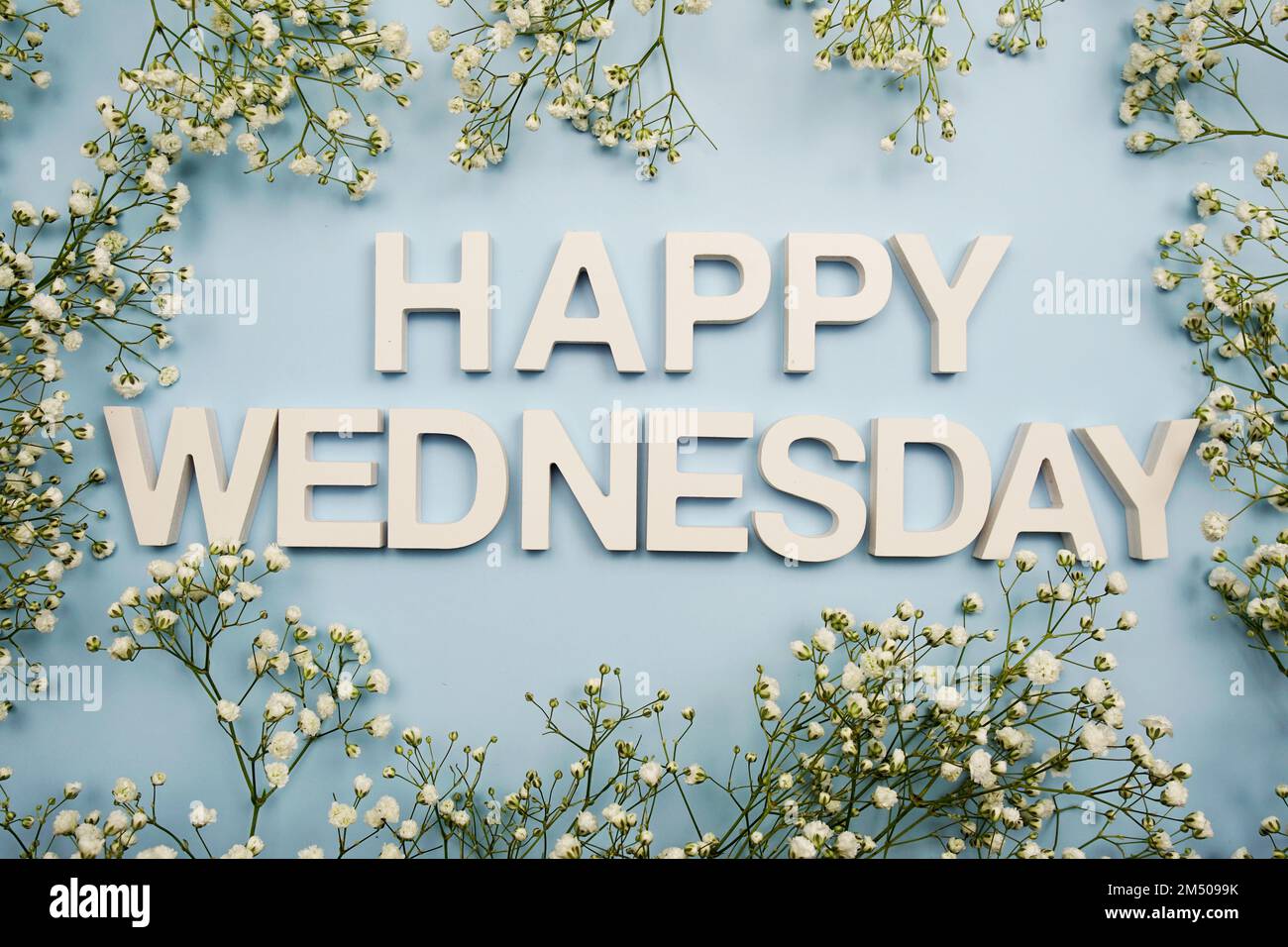 Happy Wednesday alphabet letters on blue background Stock Photo - Alamy