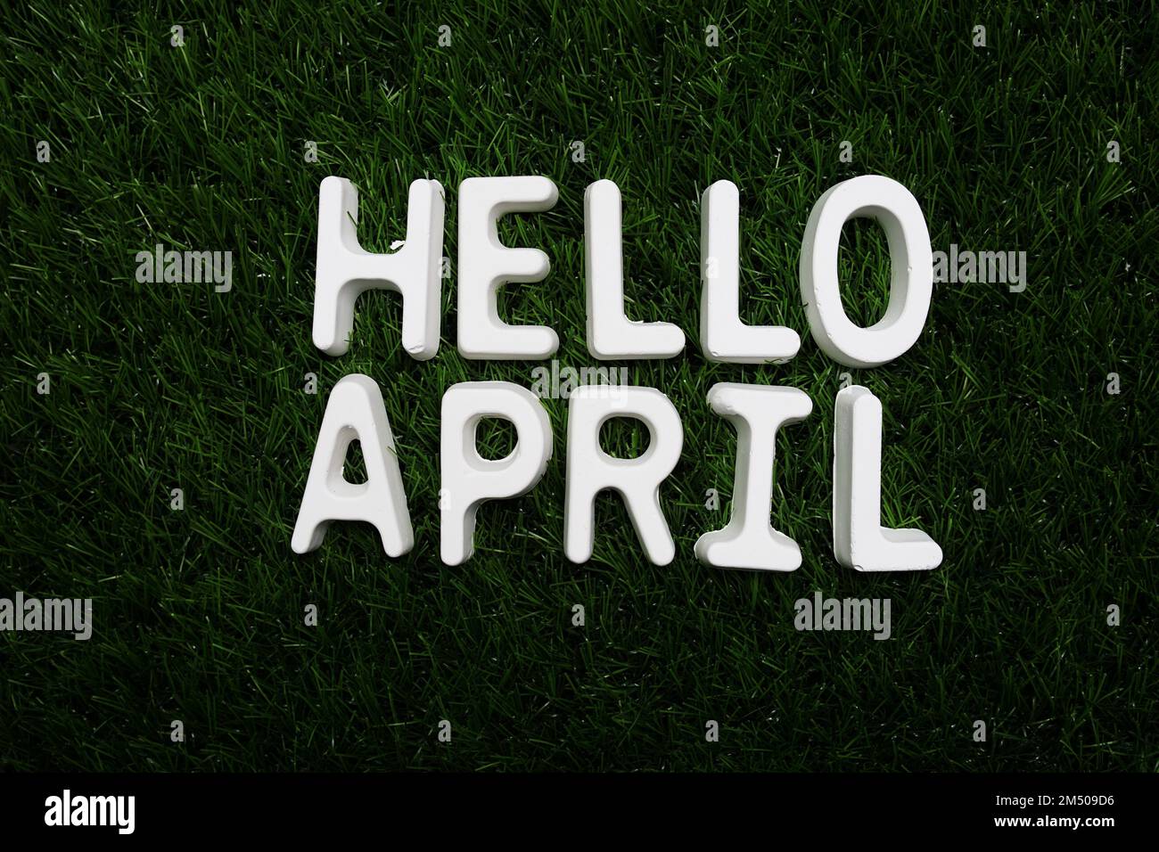 Hello April alphabet letter on green grass background Stock Photo - Alamy