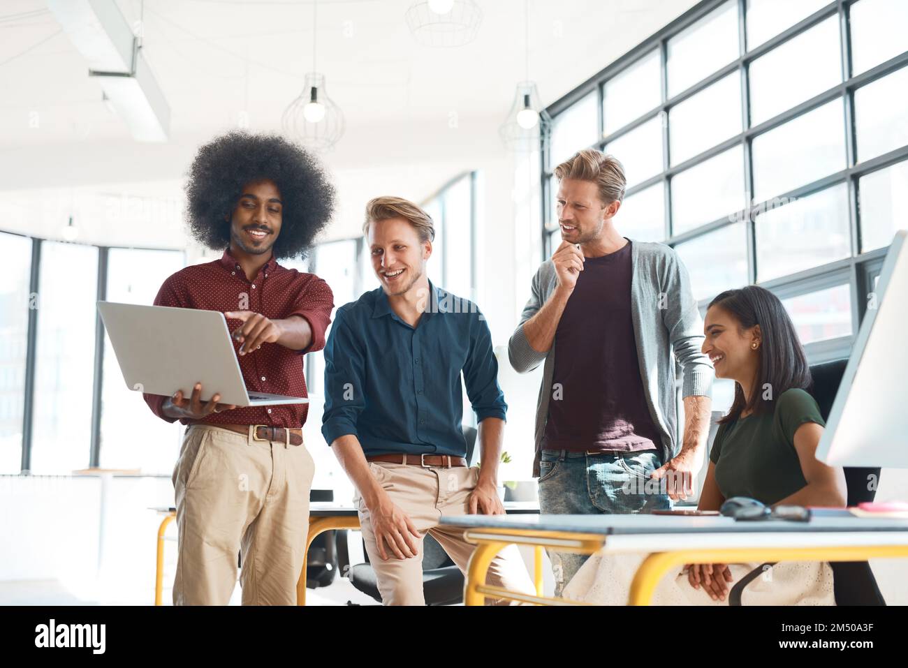 Success is a team effort. a group of creative designers hard at work in ...