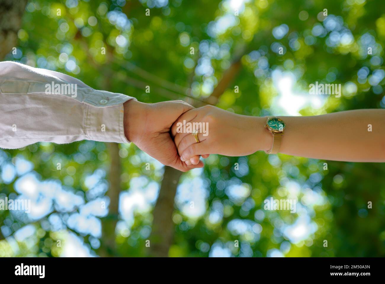 a man and a woman hold hands - a strong spiritual and physical ...