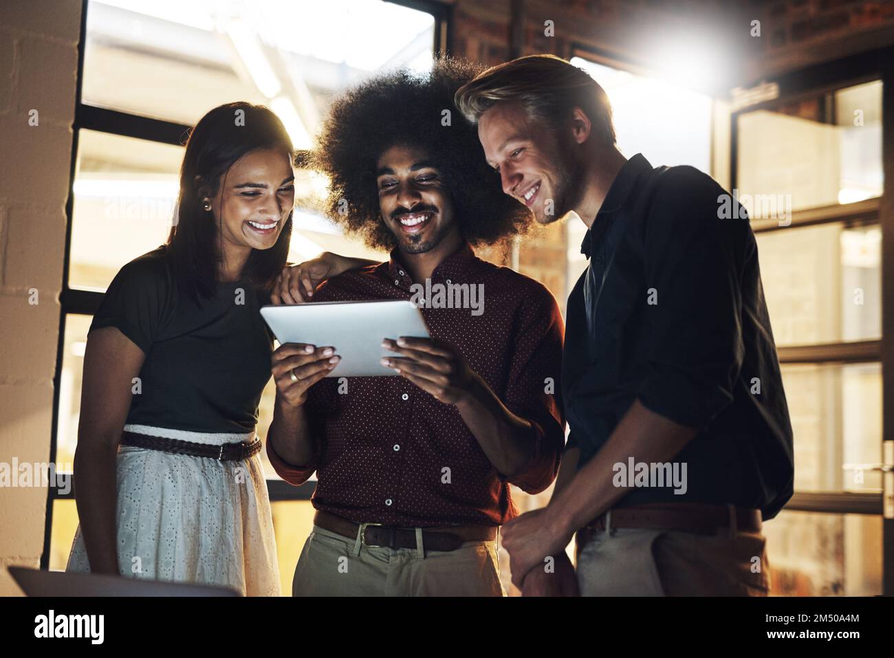 Things are progressing nicely. a group of young designers having a ...