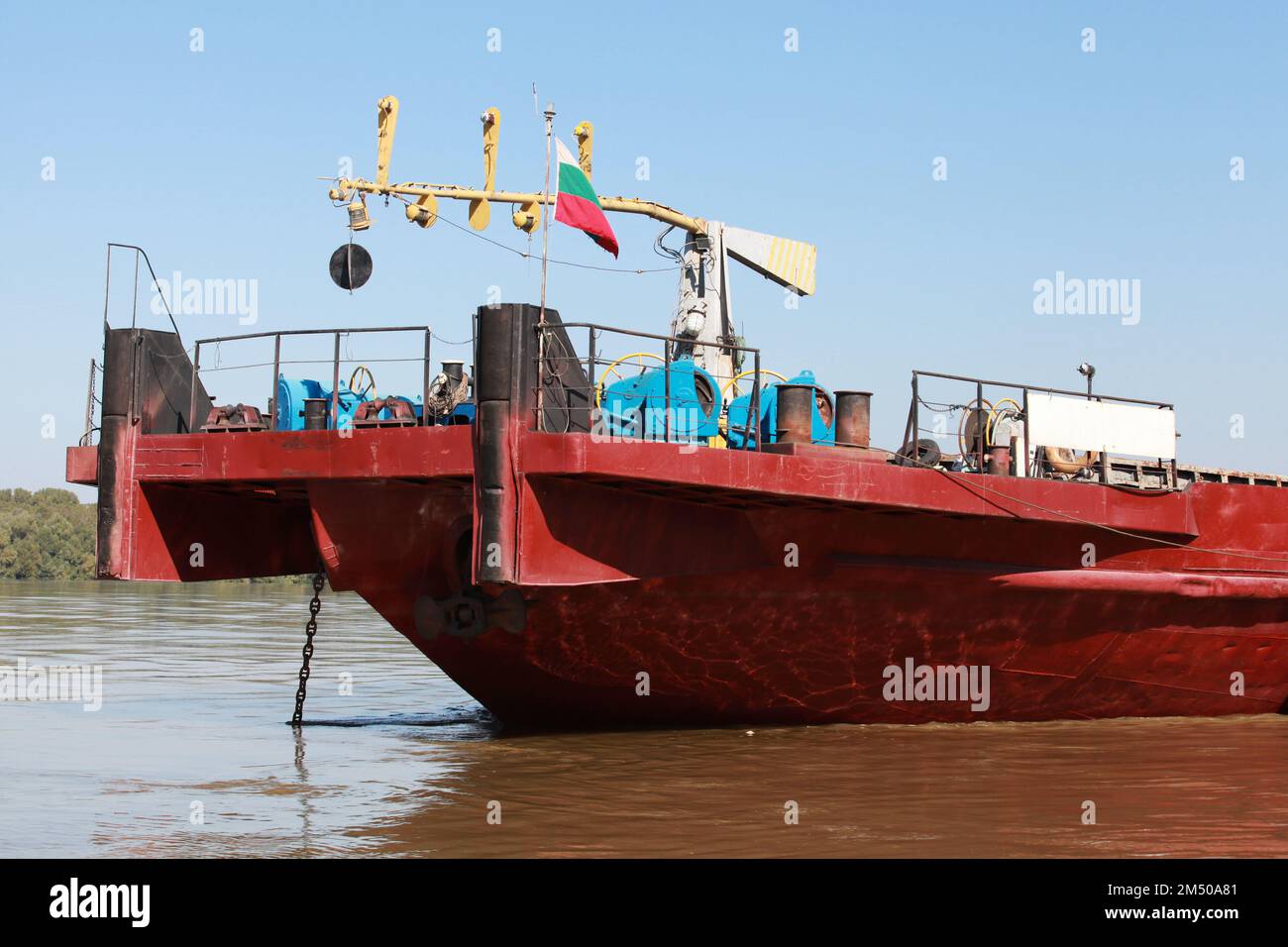 Red bow of a cargo river ship under Bulgarian flag anchored at Danube ...