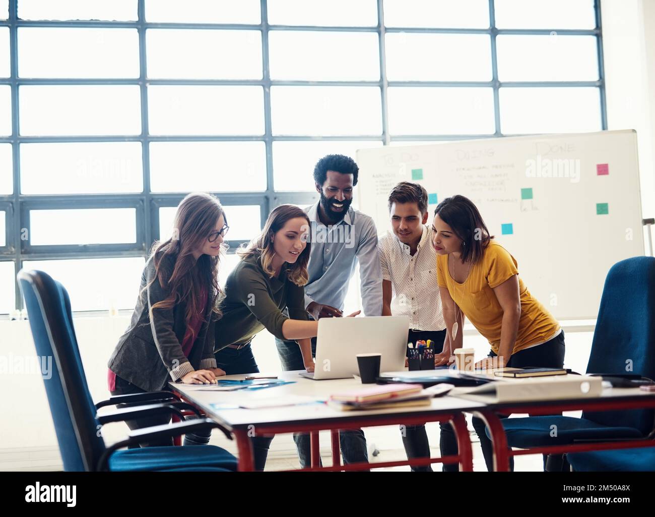 We conquer every situation together. creative employees having a ...