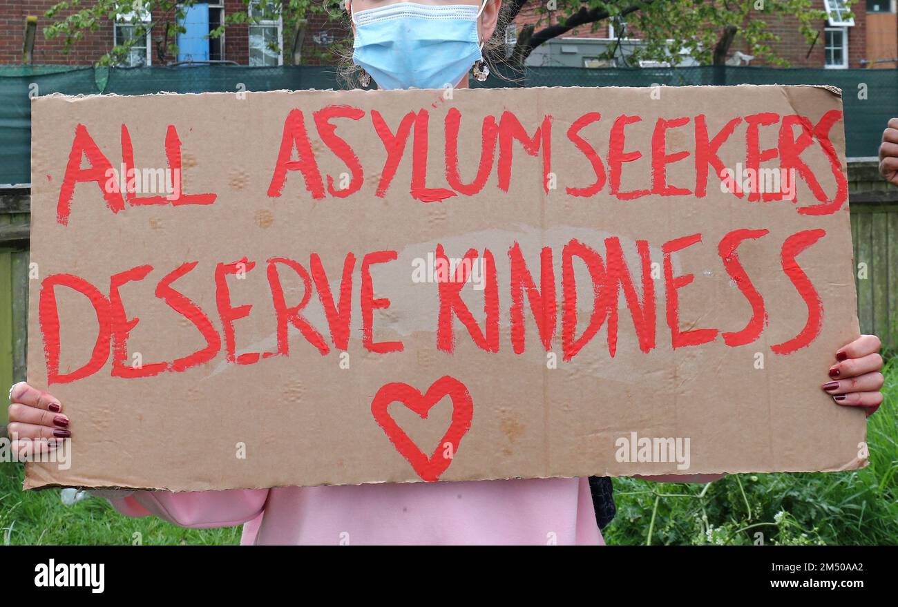 File photo dated 22/05/21 of a person holding up a sign during a ...