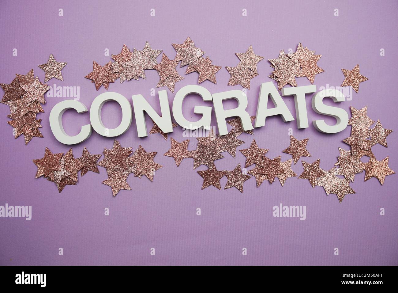 Congrats alphabet letters on purple background Stock Photo - Alamy