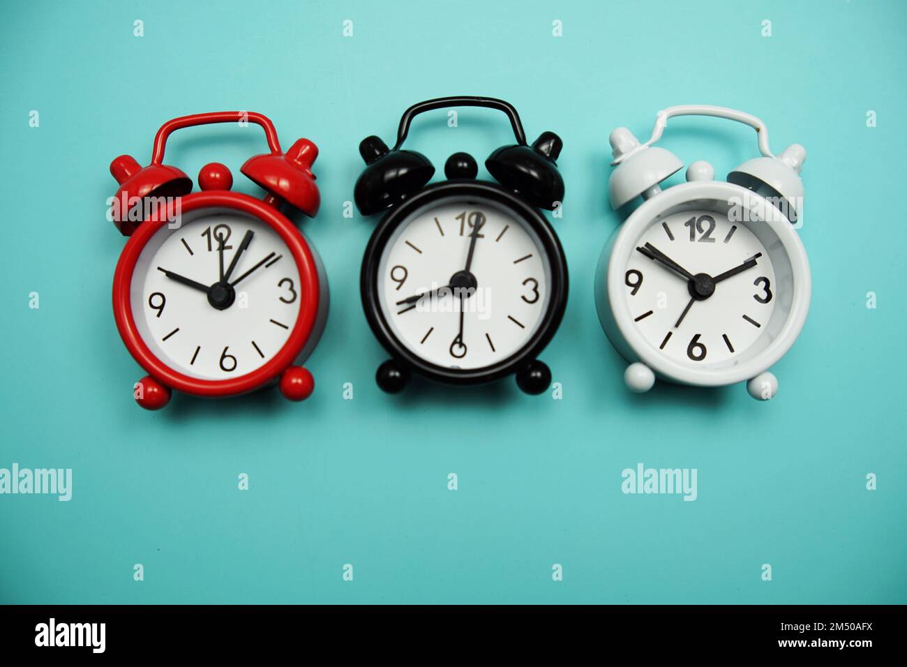 Top view of alarm clocks with different time Flat lay composition on ...