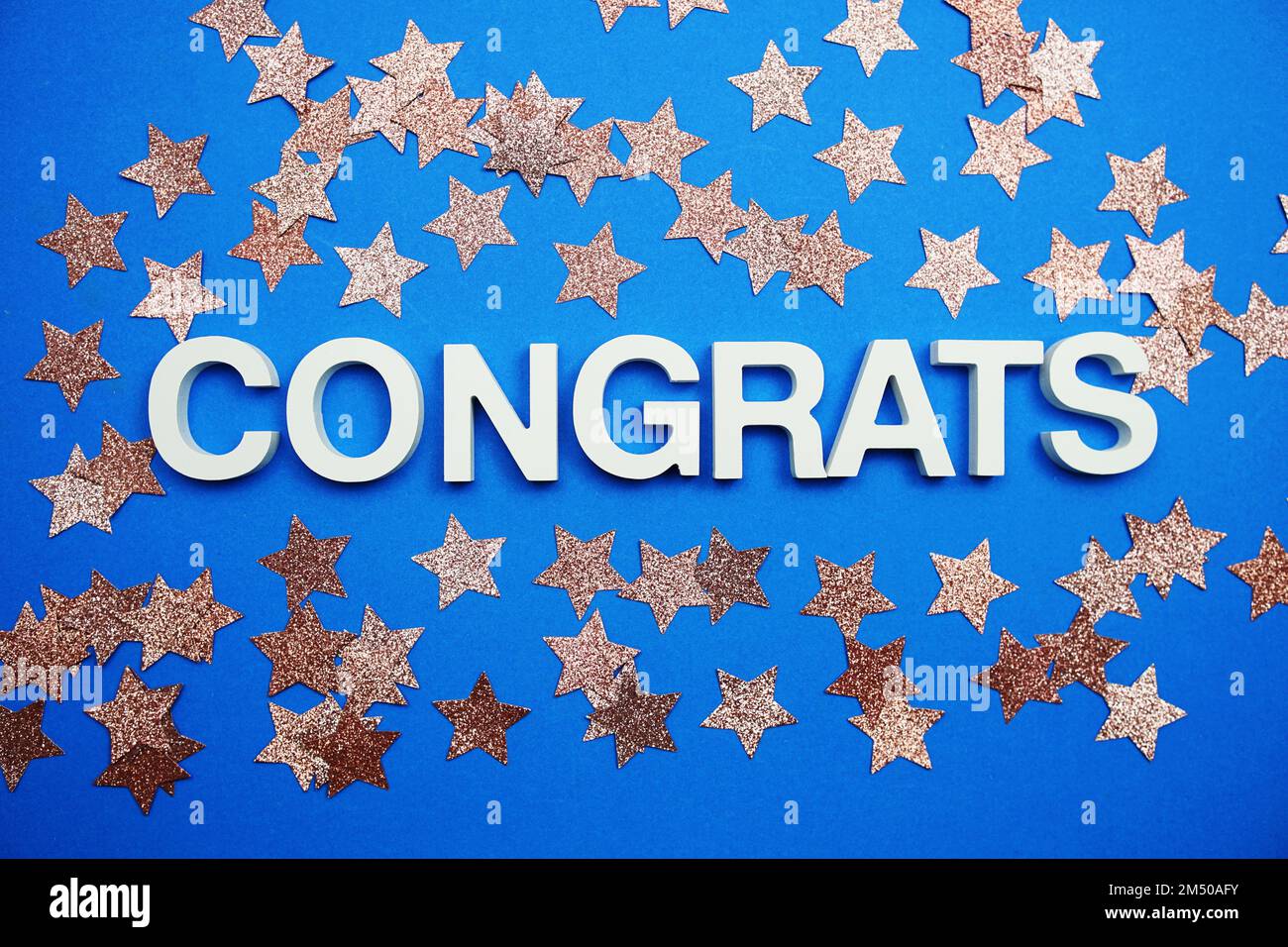 Congrats alphabet letters on blue background Stock Photo - Alamy