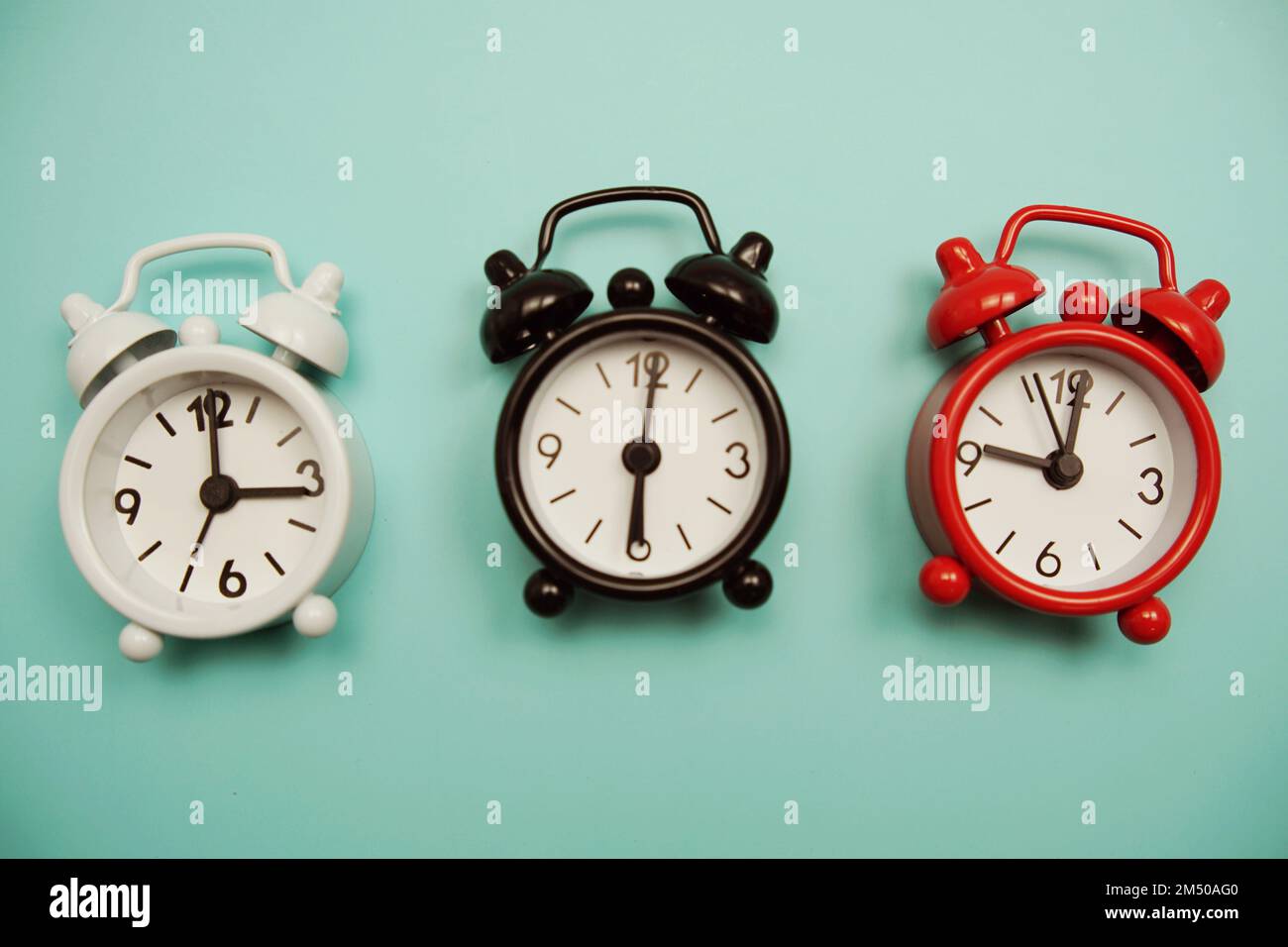 Top view of alarm clocks with different time Flat lay composition on ...