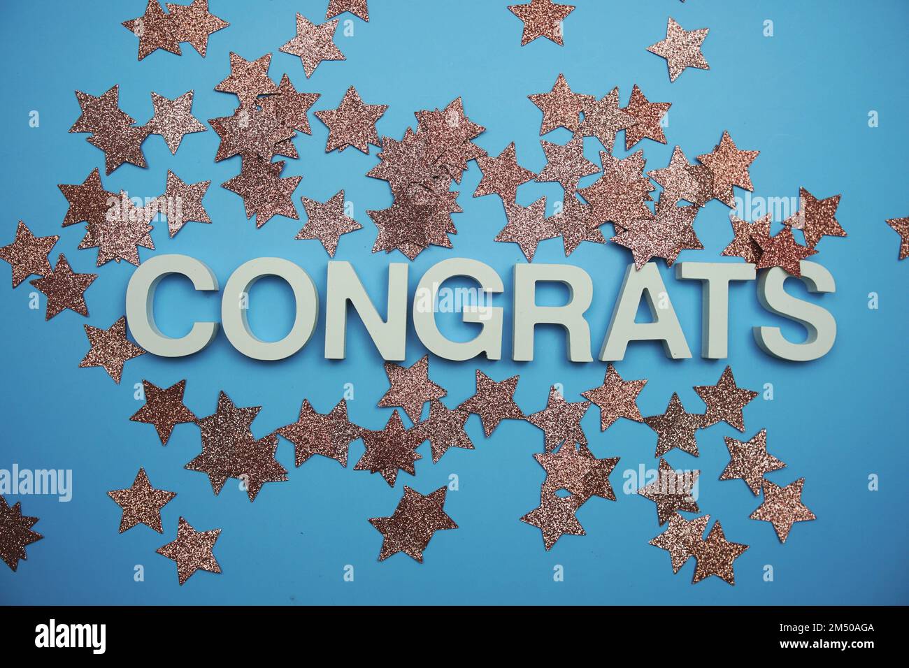 Congrats alphabet letters on blue background Stock Photo - Alamy