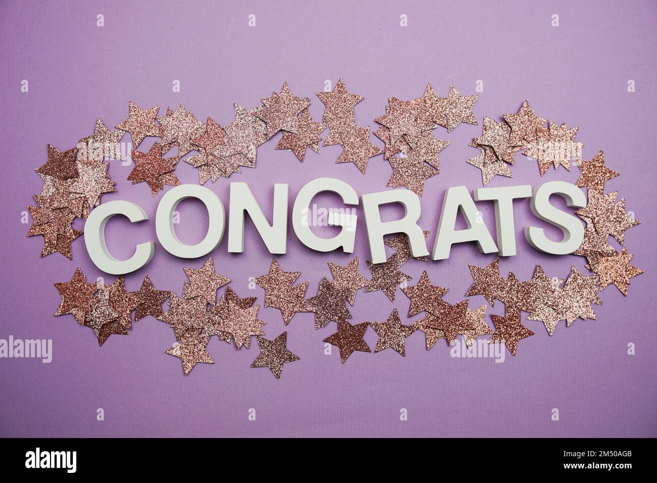 Congrats alphabet letters on purple background Stock Photo - Alamy