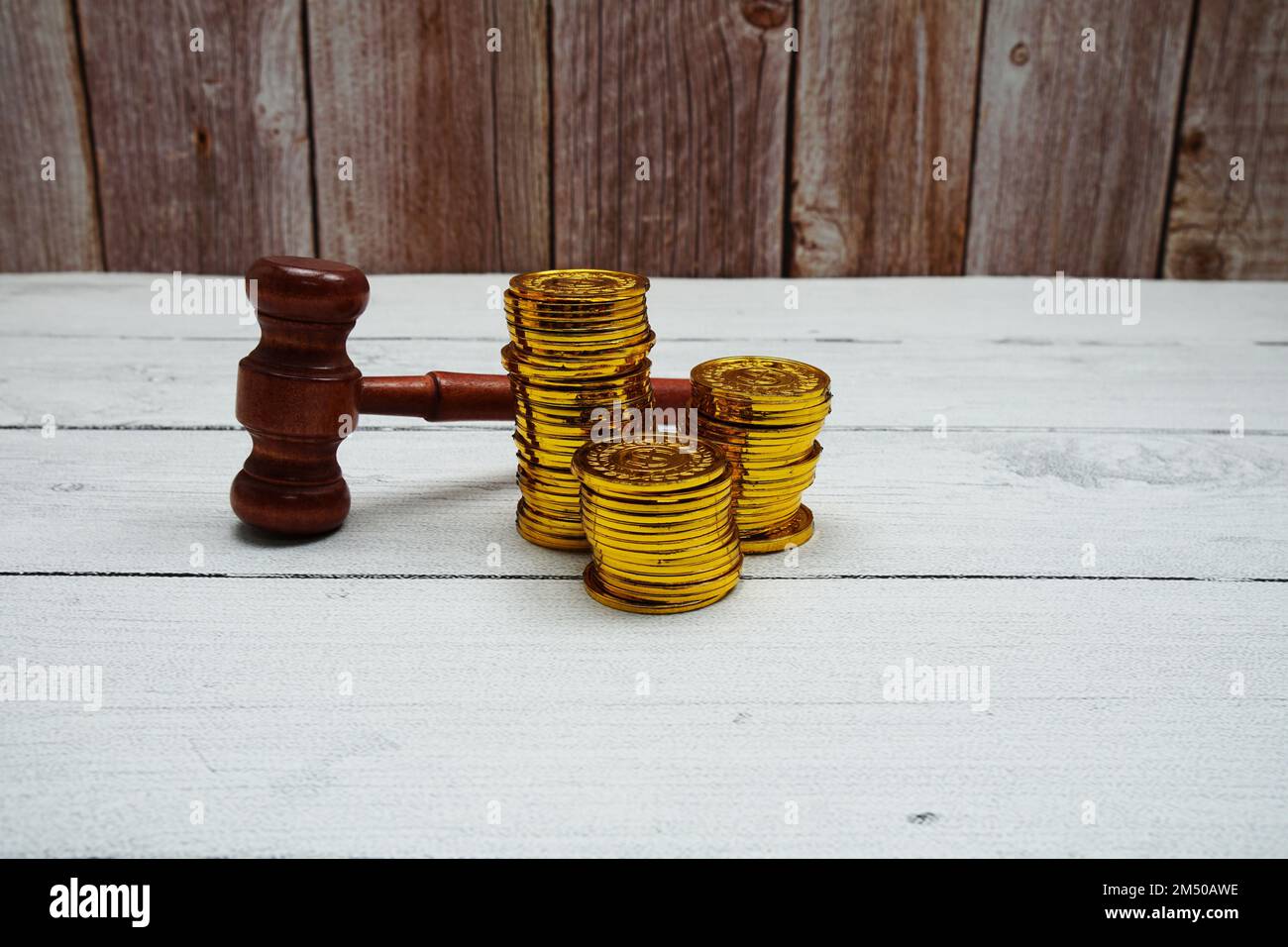 Golden coin and wooden judge gavel, Auction and bidding concept Stock ...