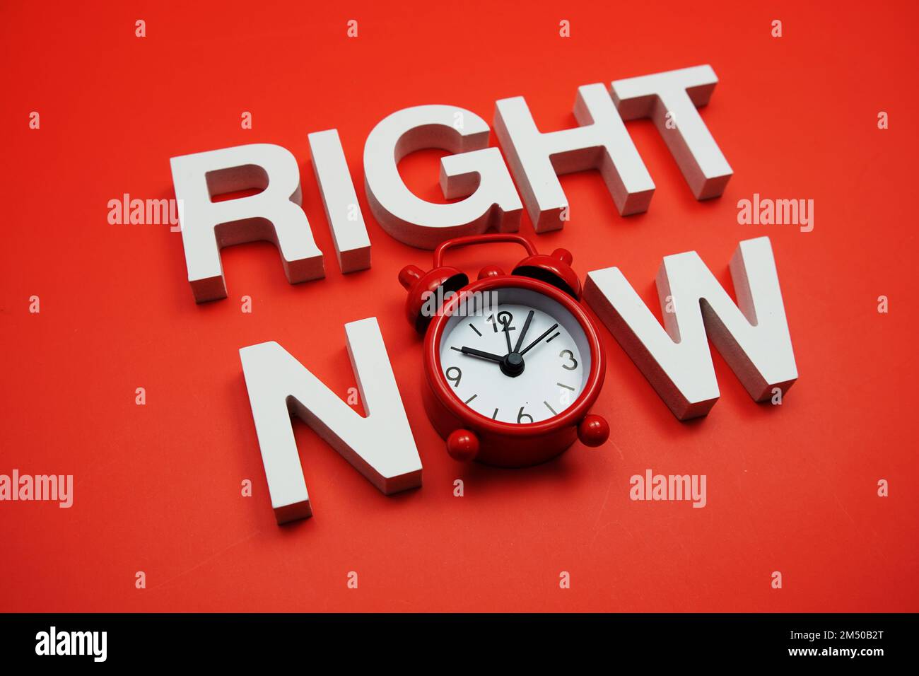 Right Now alphabet letters on red background Stock Photo - Alamy