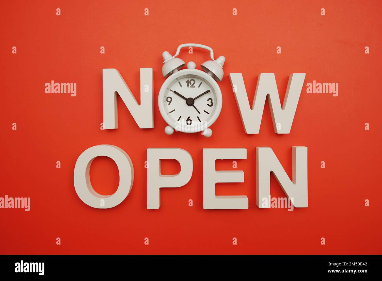 Now Open alphabet letters on red background Stock Photo - Alamy