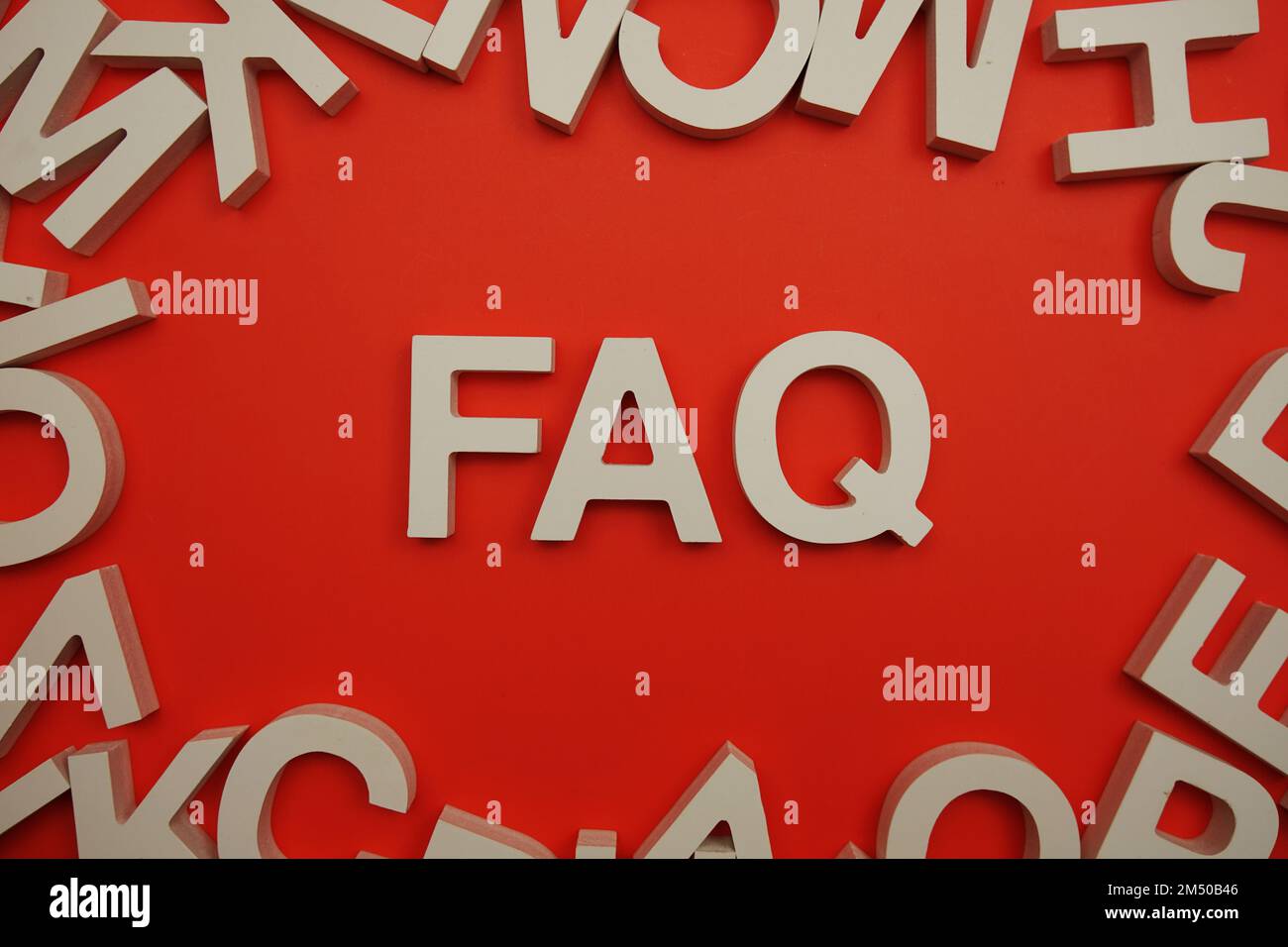 FAQ alphabet letters on red background Stock Photo - Alamy