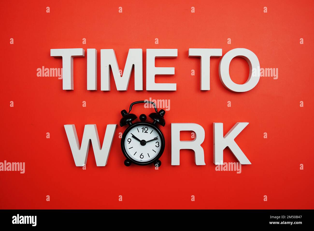 Time to Work alphabet letters on red background Stock Photo - Alamy