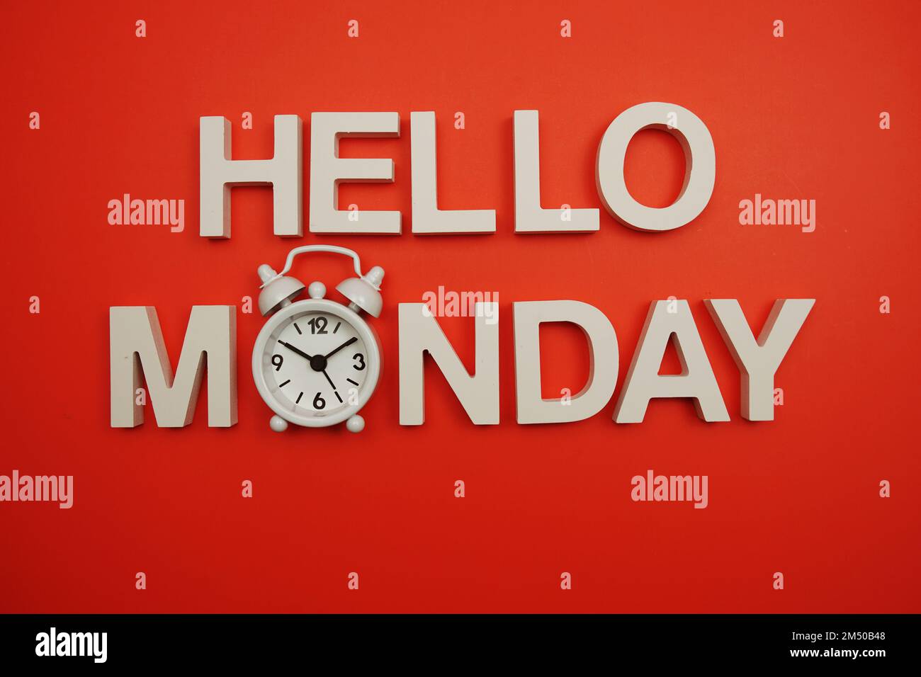 Hello Monday alphabet letters on red background Stock Photo - Alamy