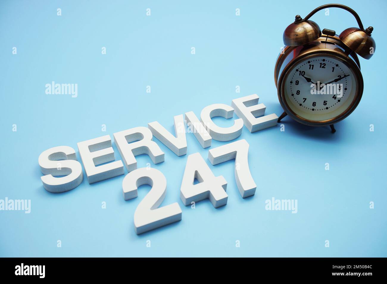 24/7 Service alphabet letters on blue background Stock Photo - Alamy