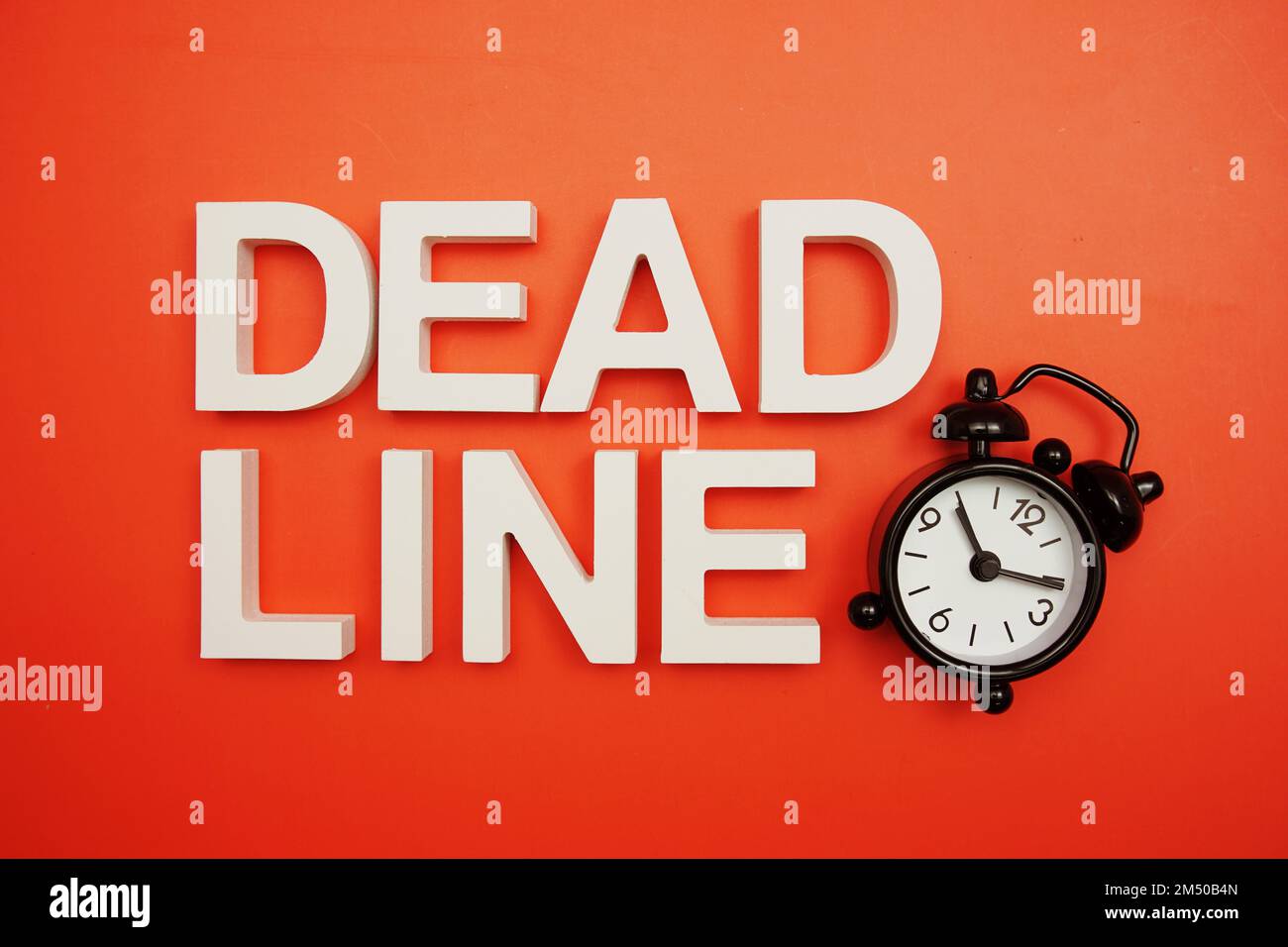Deadline alphabet letters on red background Stock Photo - Alamy