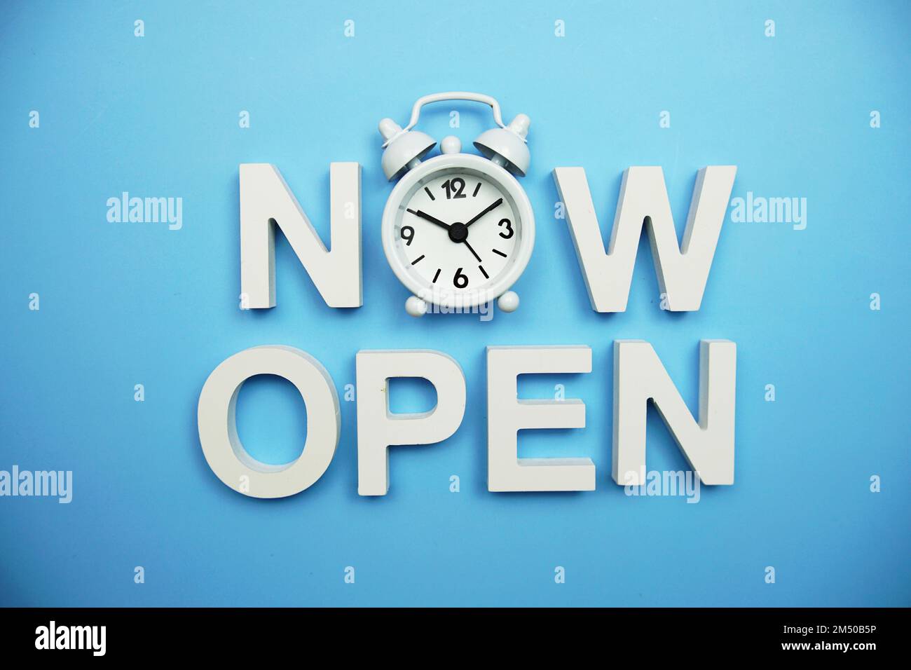 Now Open alphabet letters on blue background Stock Photo - Alamy