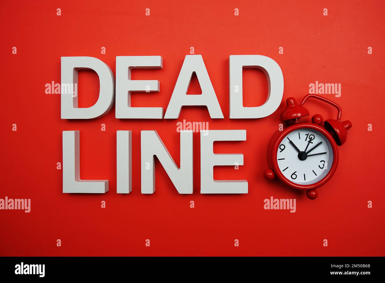 Deadline alphabet letters on red background Stock Photo - Alamy