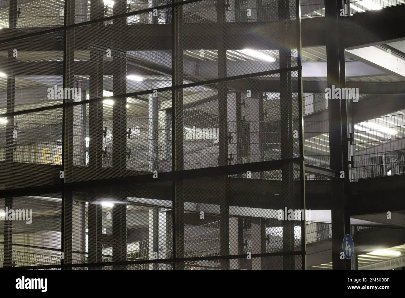 barred empty Parking garage at Night Stock Photo - Alamy