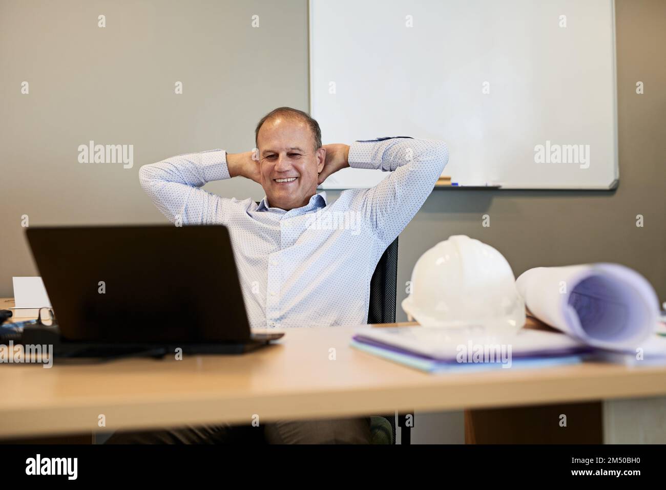 My work is done for the day. a cheerful professional male businessman ...