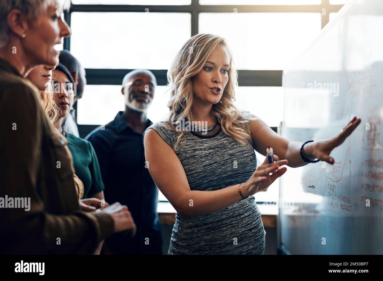 Handing over her responsibilities. a pregnant businesswoman giving a ...