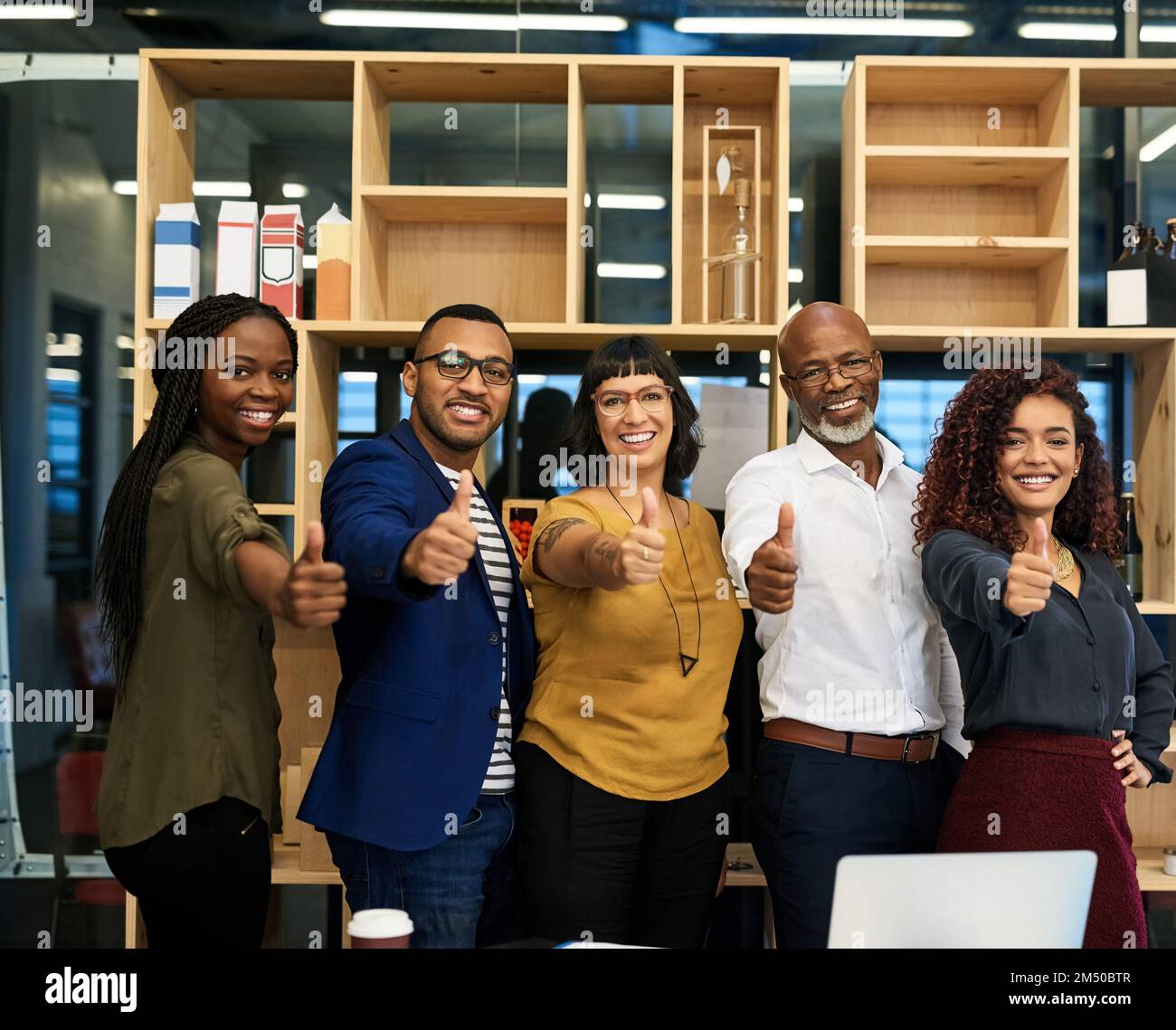 Teamwork is the way to go. Portrait of a group of creative ...