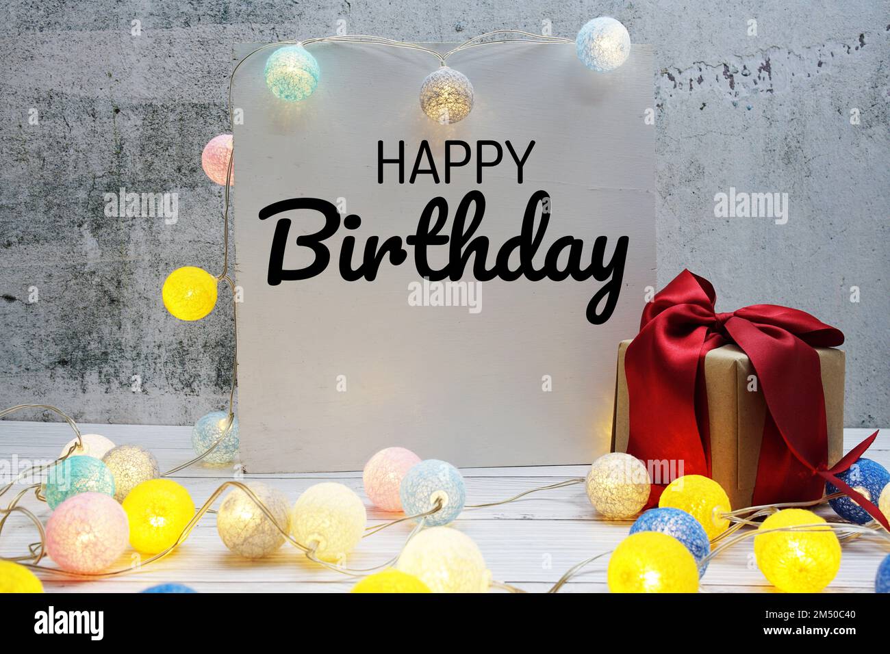 Happy Birthday text message with LED cotton ball decoration on wooden ...