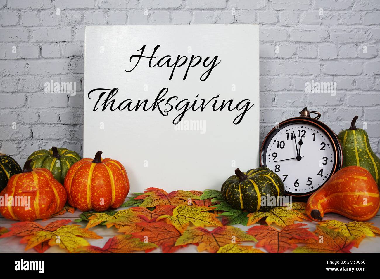 Happy Thanksgiving text message with pumpkin and maple leaf decoration ...