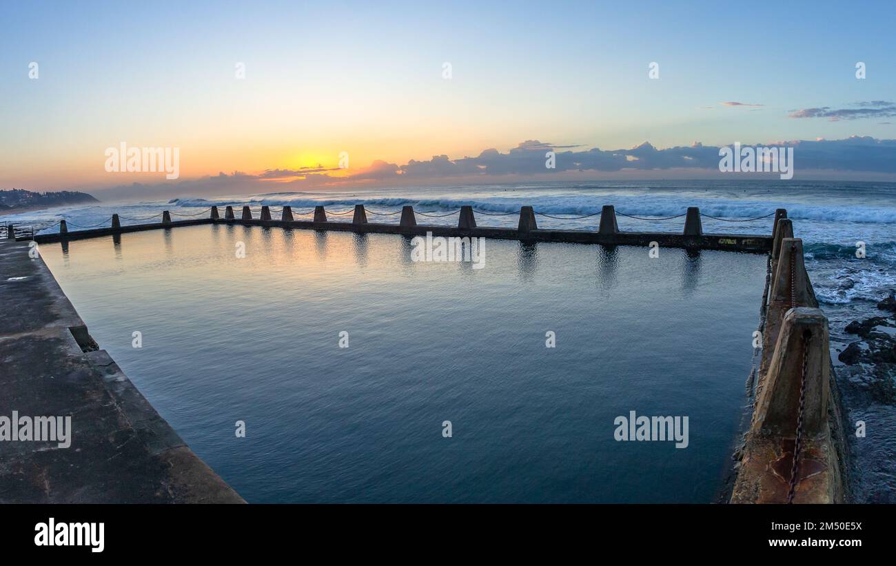 Beach ocean tidal swimming pool with smooth calm sea water at dawn sun ...